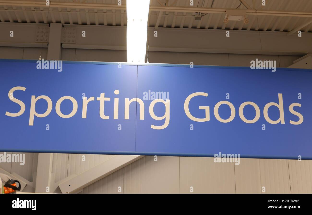 Motion of sporting good sign on sport equipment section inside Walmart ...
