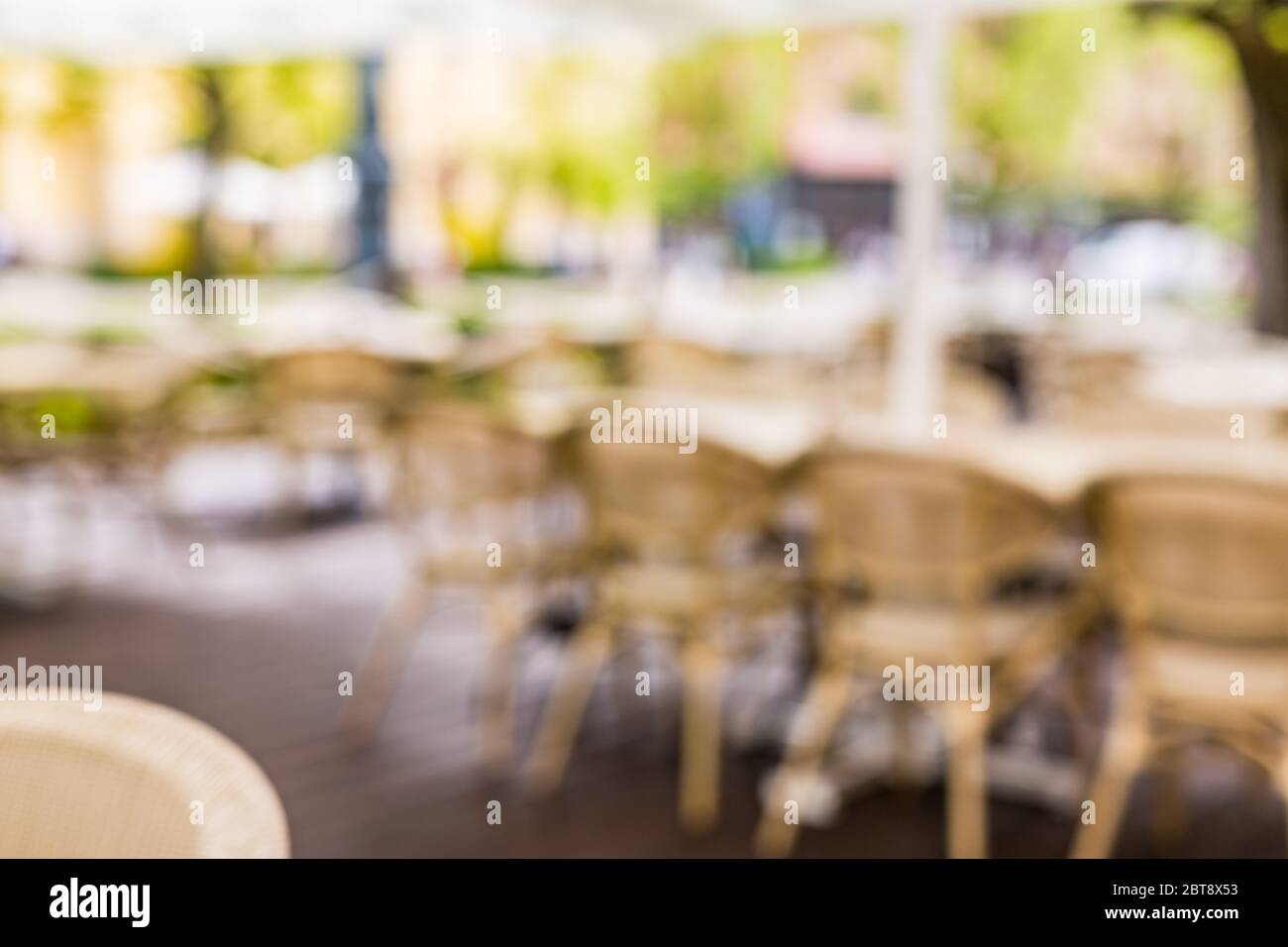Abstract blur bokeh outdoor restaurant chairs with tables. Beautiful ...