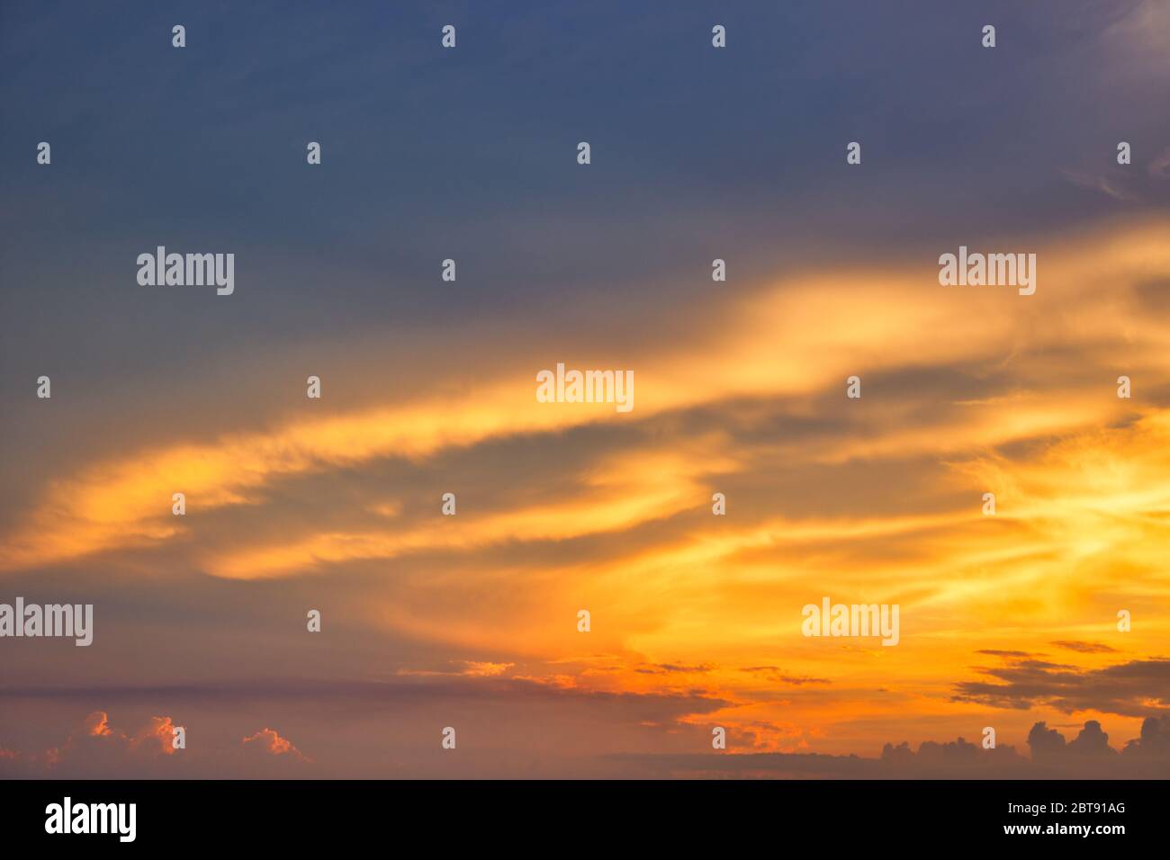 This unique photo shows a fiery red sunset sky with a cloud structure ...