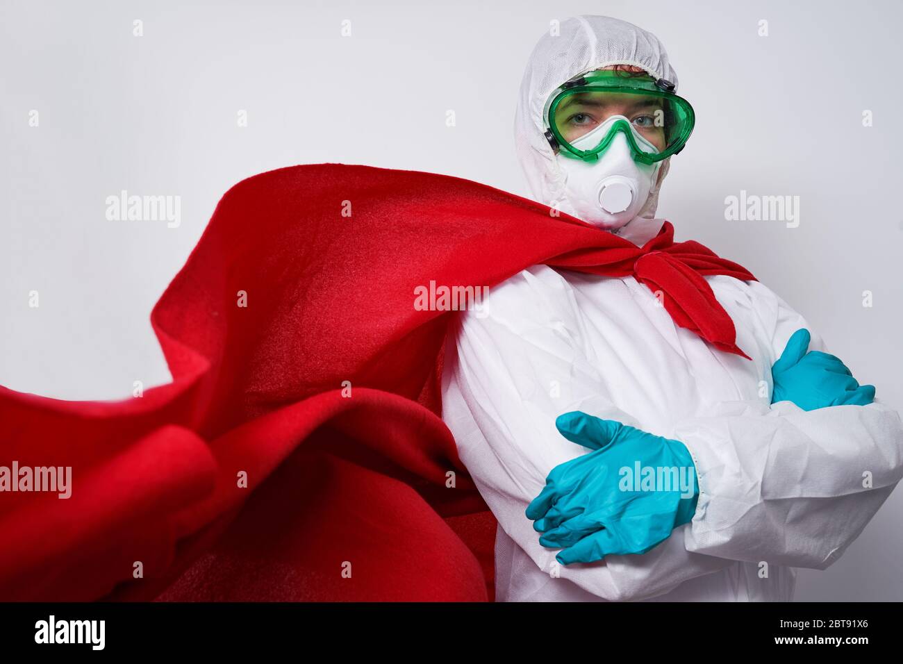 Doctor is wearing PPE - costume, gloves and surgical face mask in ...