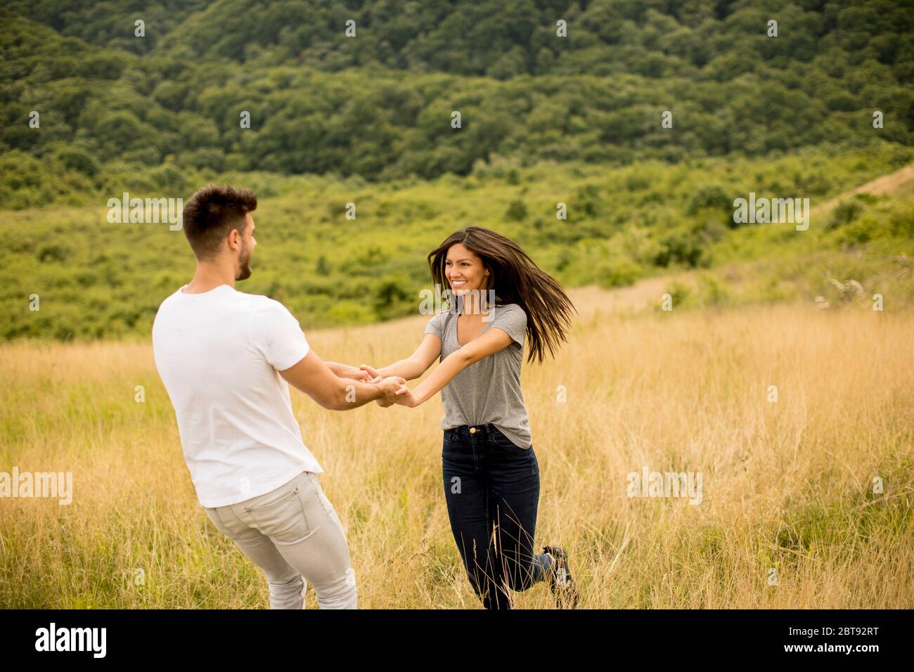Couple man woman embrace walking hi-res stock photography and images ...