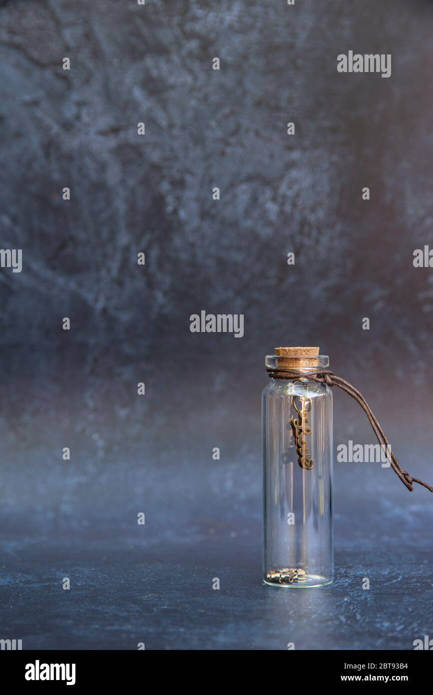 Romantic old vintage glass wish bottle with good luck charm inside ...