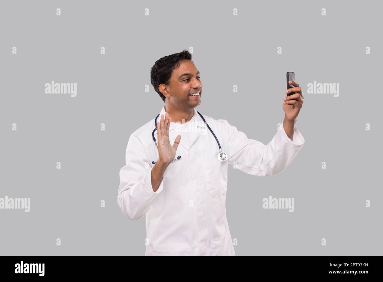 Doctor Having Video Call on Phone Isolated. Indian Man Doctor Video ...