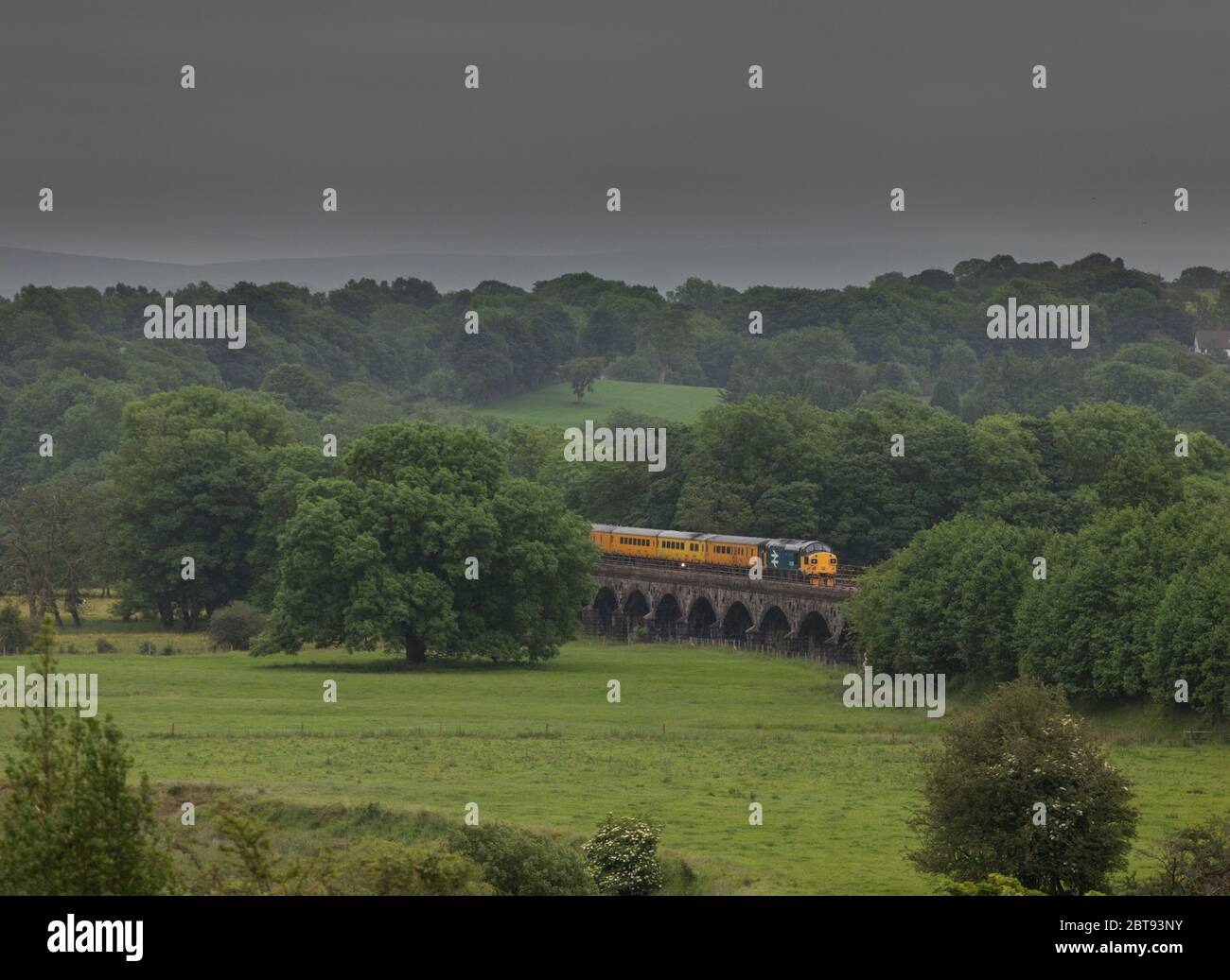 Large logo blue preserved class 37 locomotive 37025 hauling a Colas ...