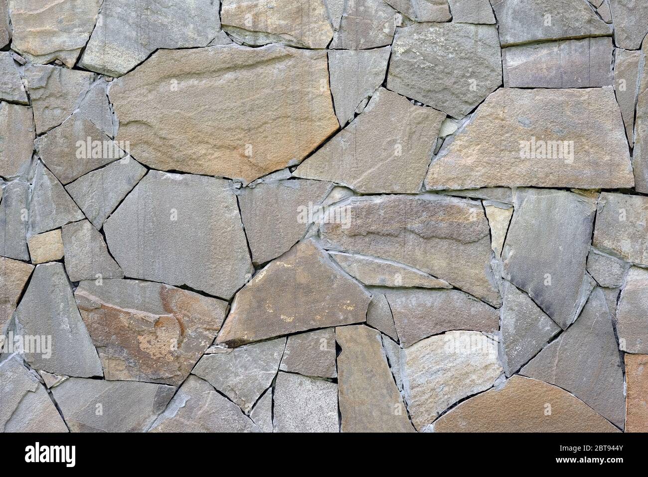 Abstract gray stone background. Mosaic pattern of old brown stones on ...