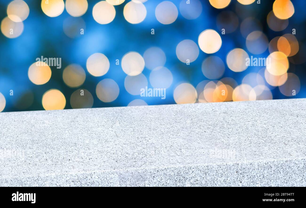 Empty diagonal stone table with blur night lights in blue sky bokeh ...