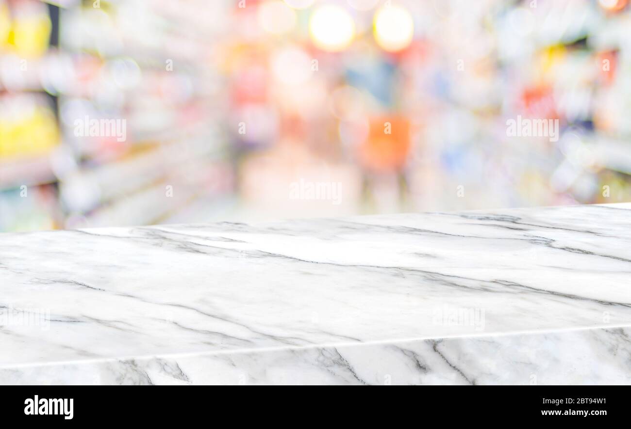 marble diagonal table with people shopping food at supermarket blur ...