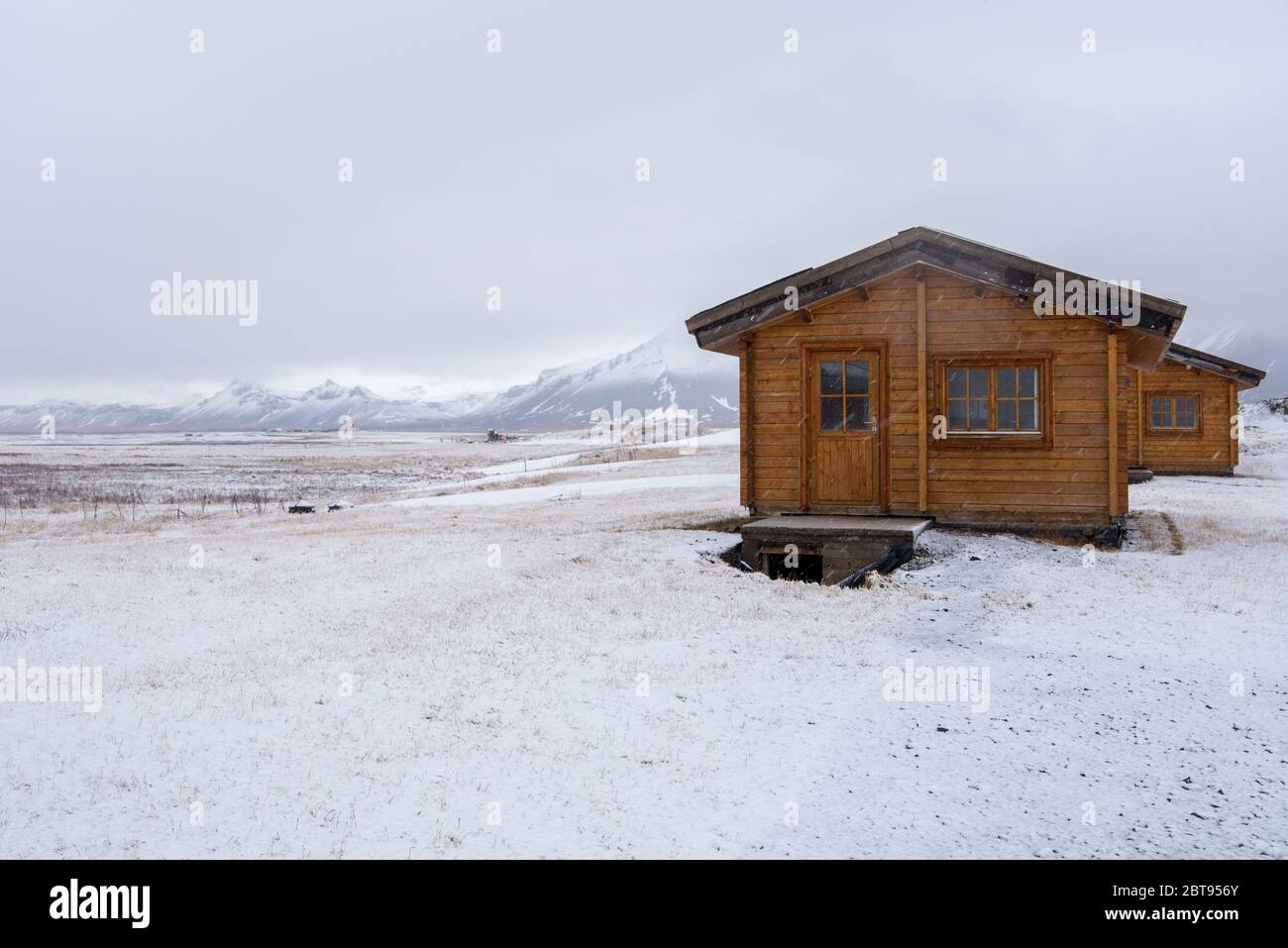 Wooden holiday chalets in winter at Snaefellness peninsula in Iceland ...