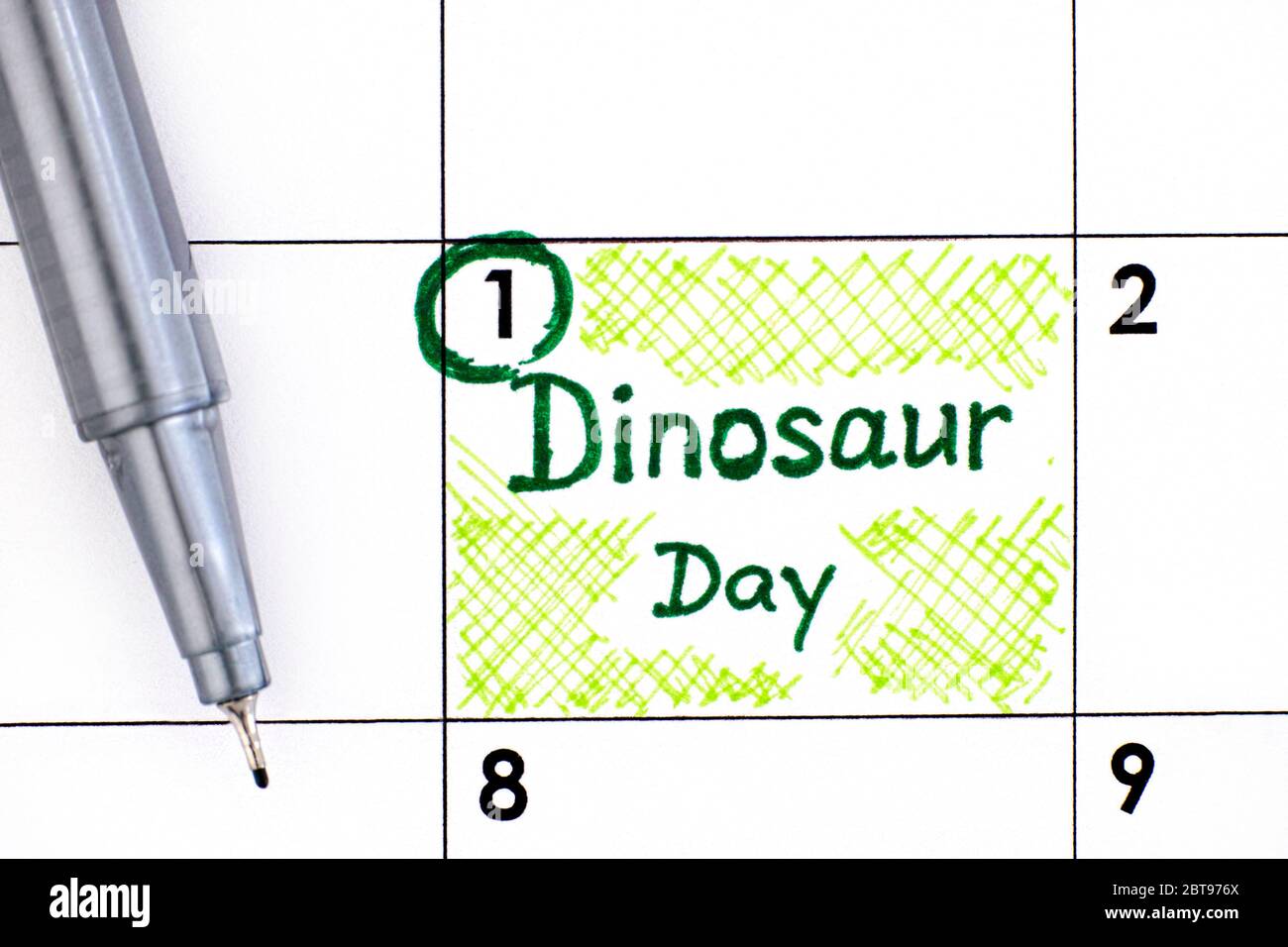 Reminder Dinosaur Day in calendar with pen. June 01 Stock Photo - Alamy