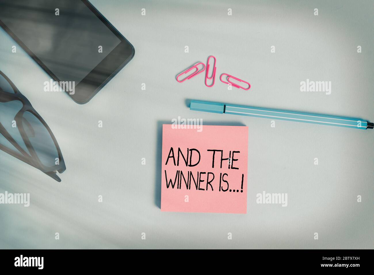 Writing note showing And The Winner Is. Business concept for announcing ...