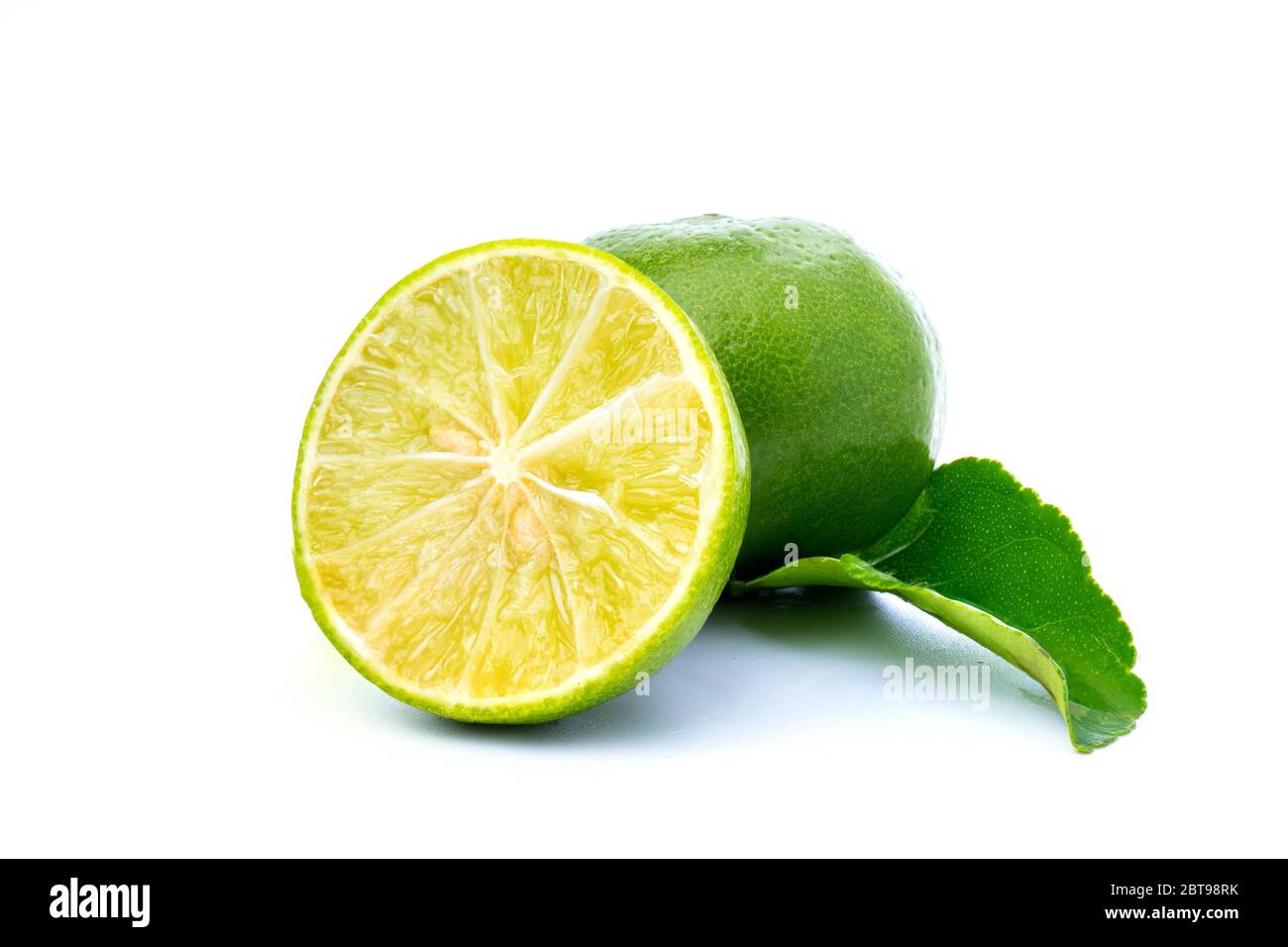 lime fruit with slice and cut piece isolated on white background Stock ...