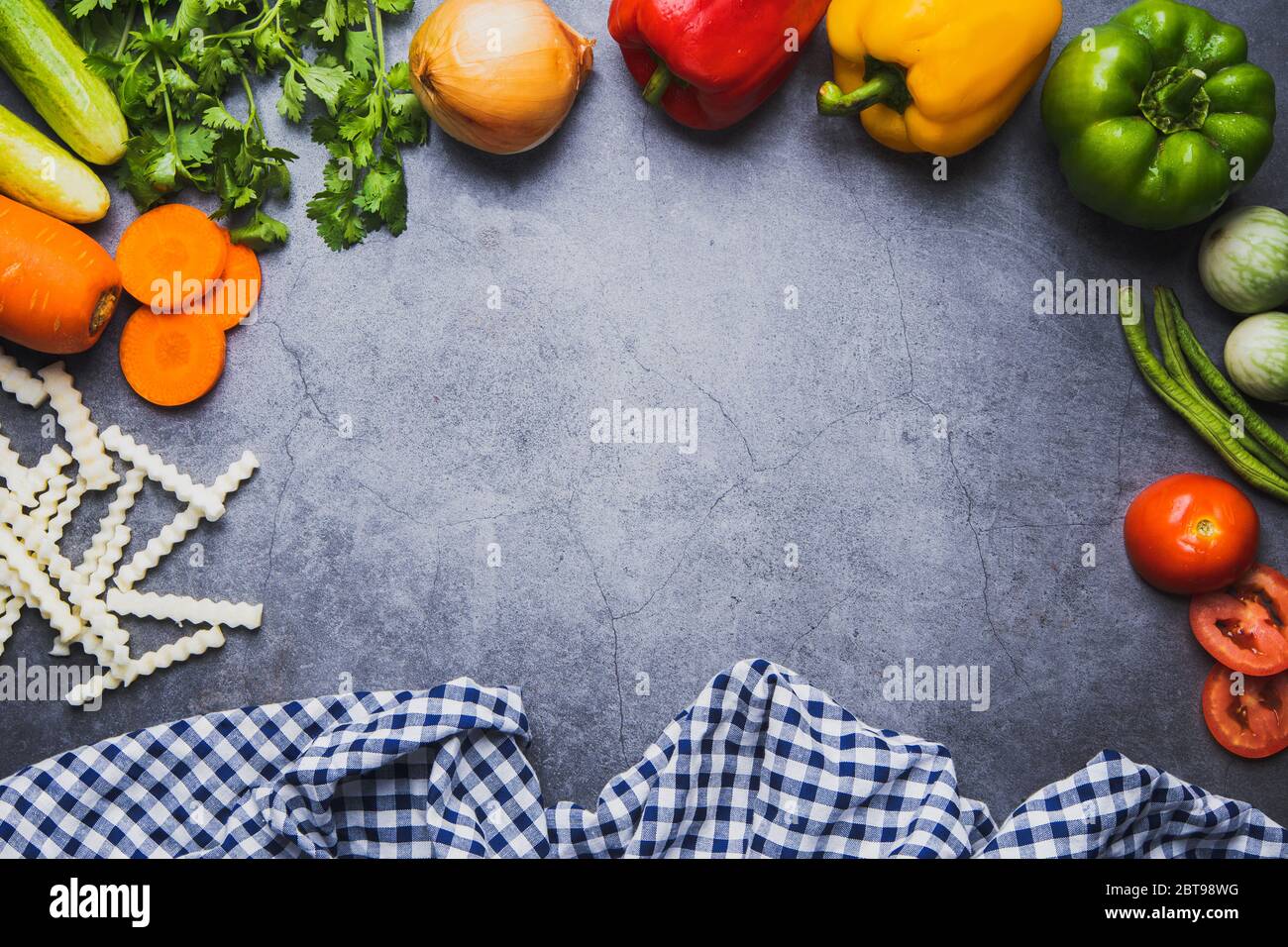 Fresh vegetables and top view mix natural nutrition on dark cement ...