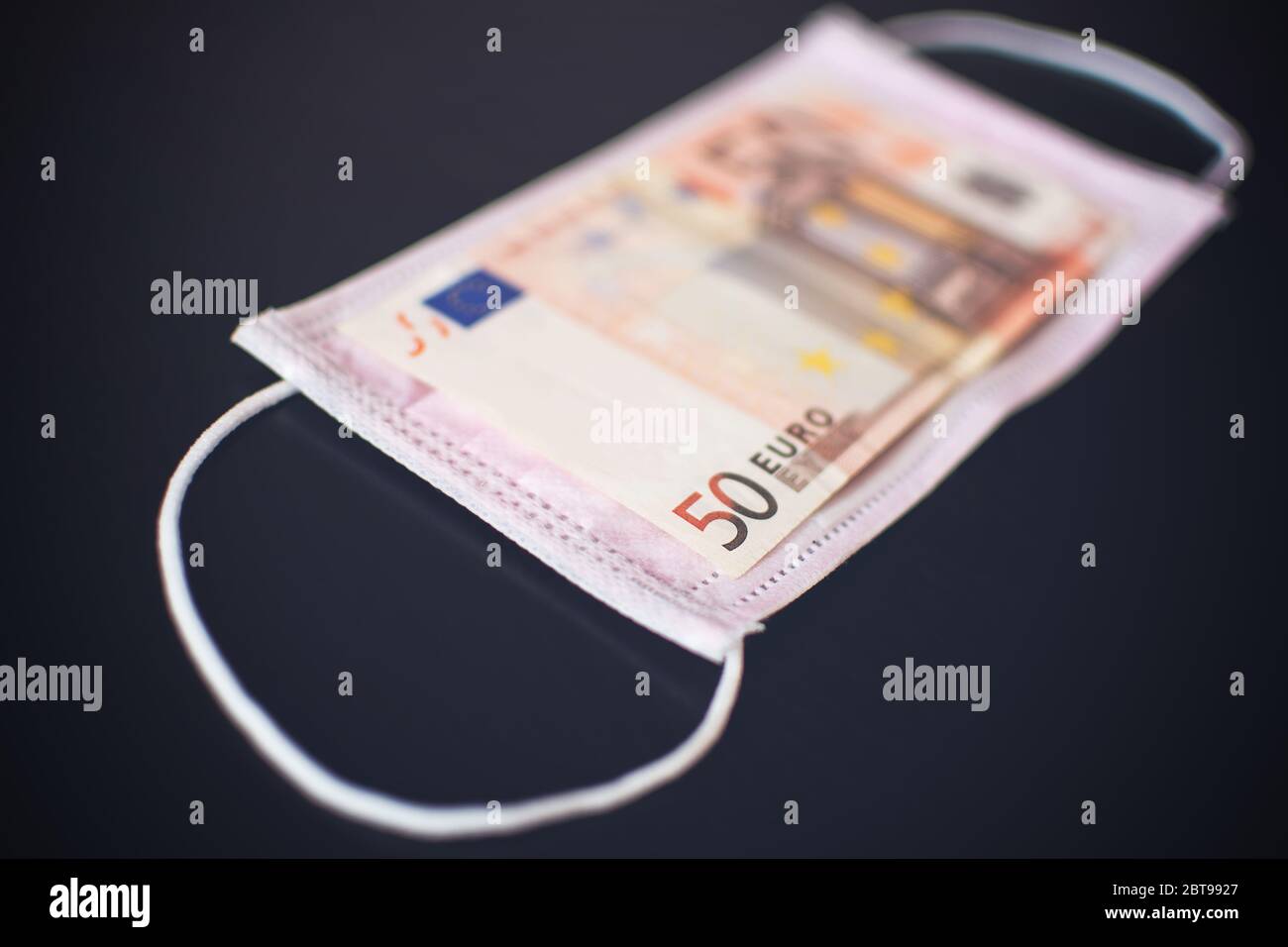 Medical face masks and money. Surgical face mask. COVID-19 Has Caused A ...