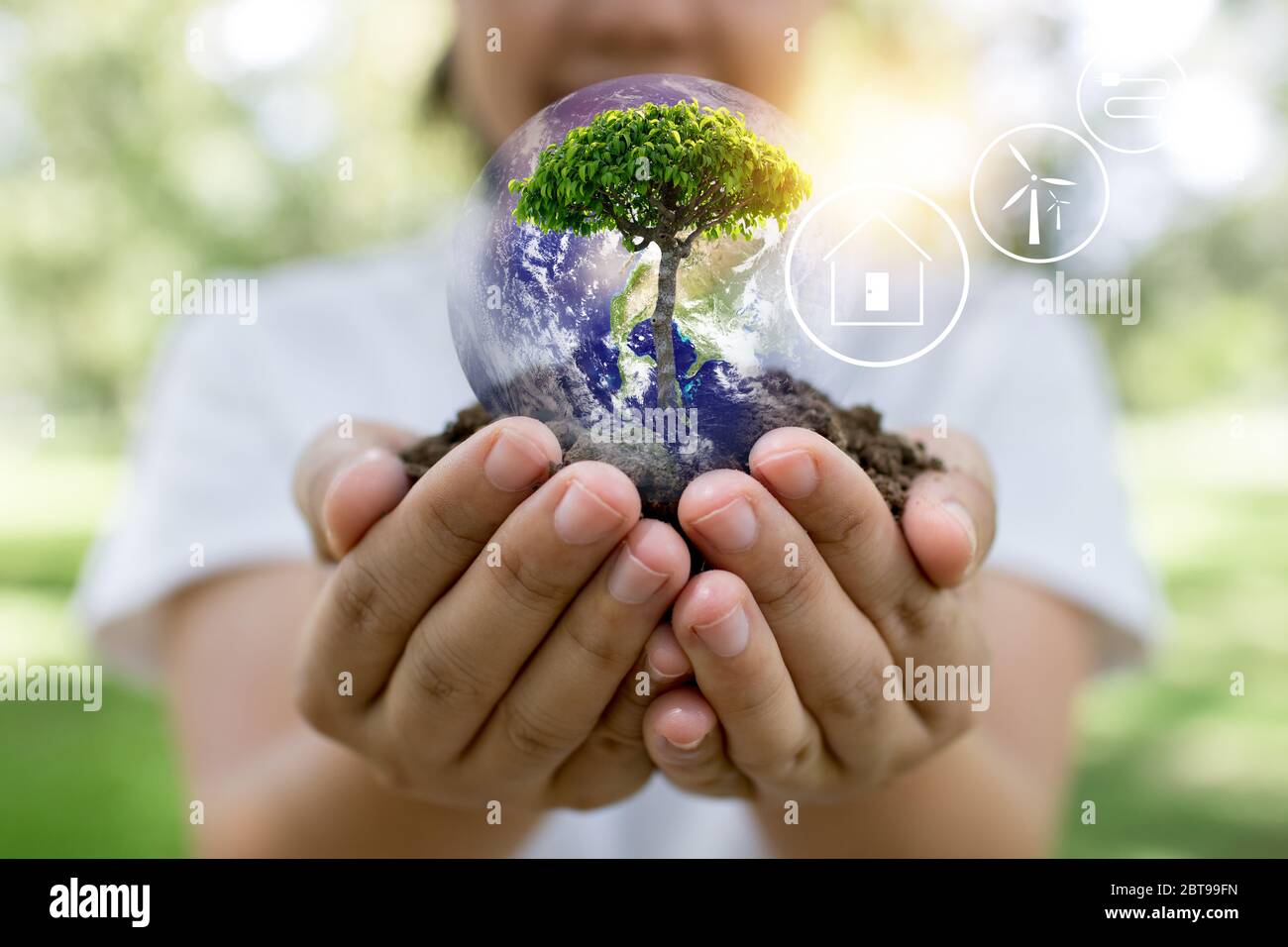 save world and innovation concept, girl holding small plant or tree ...
