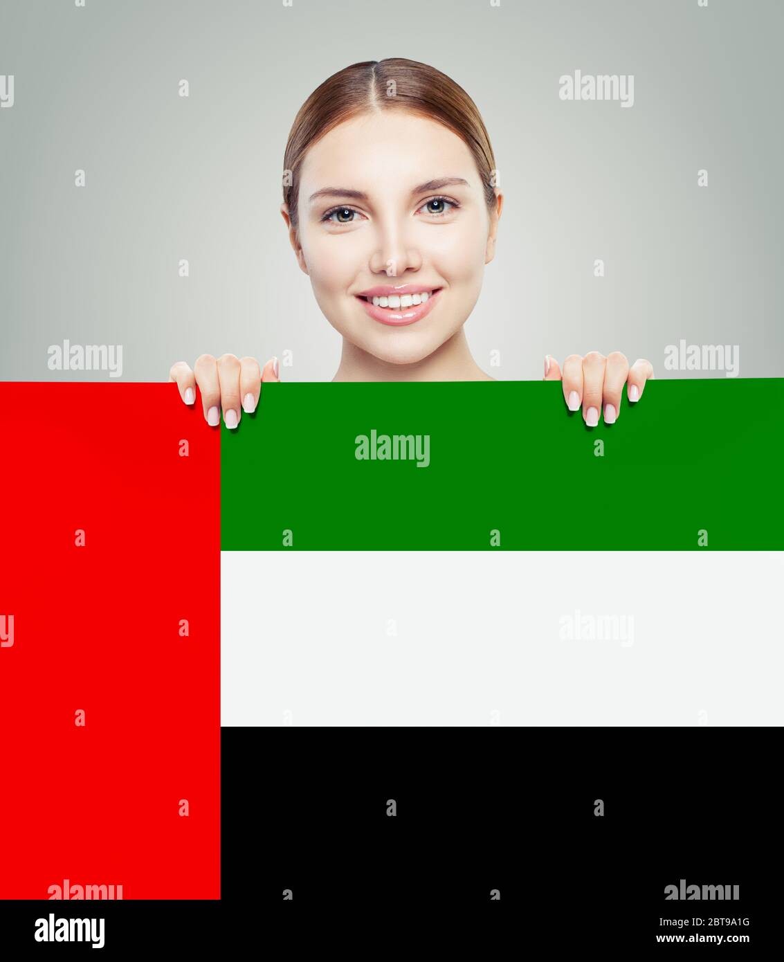 Happy woman student with the UAE flag background. United Arab Emirates ...