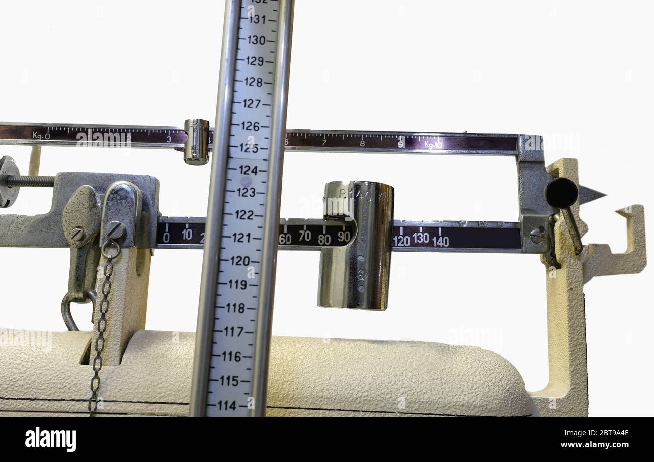 vintage scale for measuring the weight and height of children in the ...
