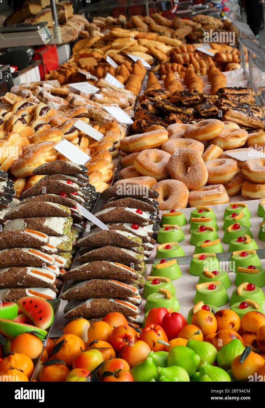 pastry shop window with many pastries for sale Stock Photo - Alamy