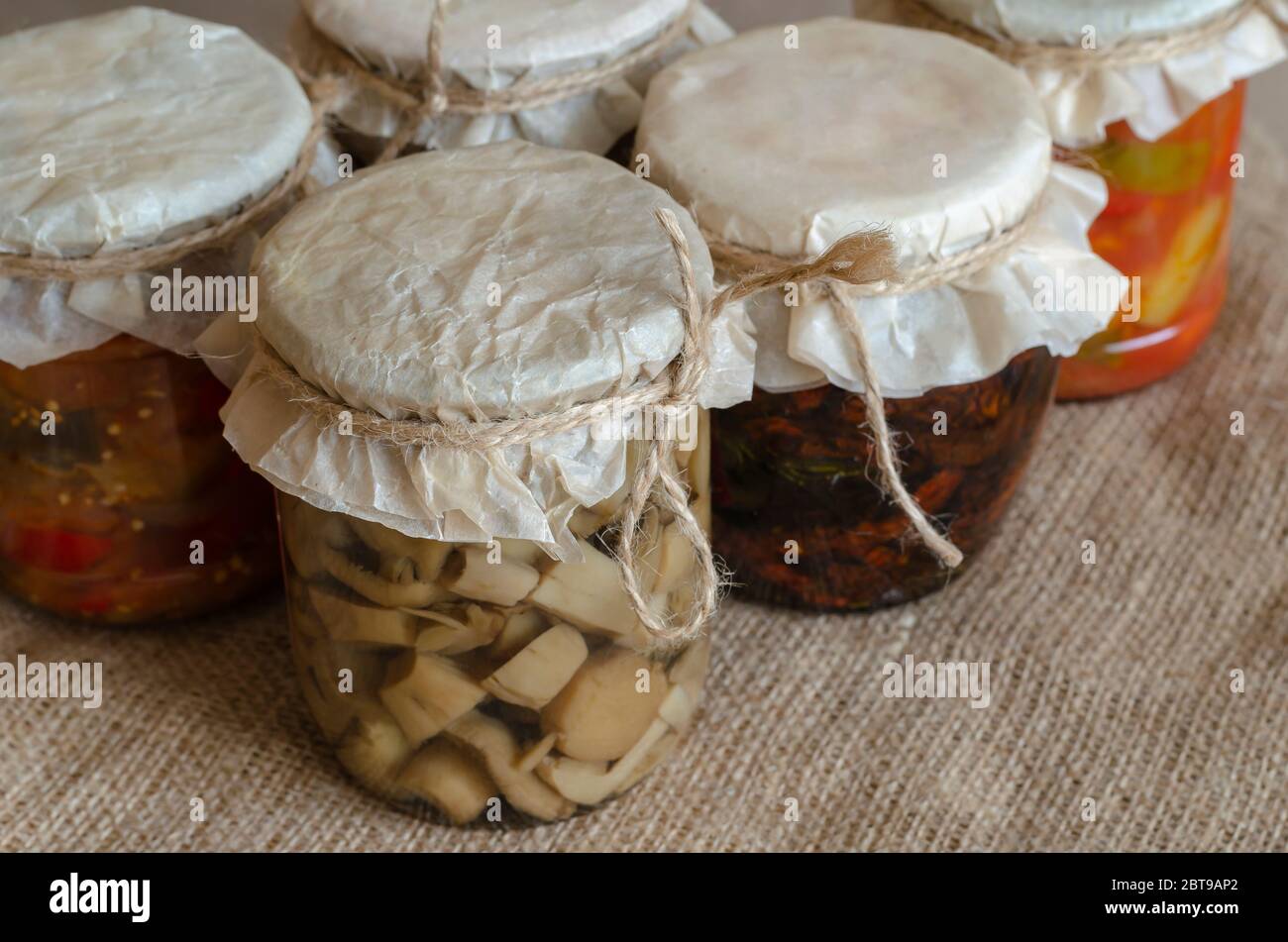 Homemade canned food. Canned food in glass jars. Various canned food on ...