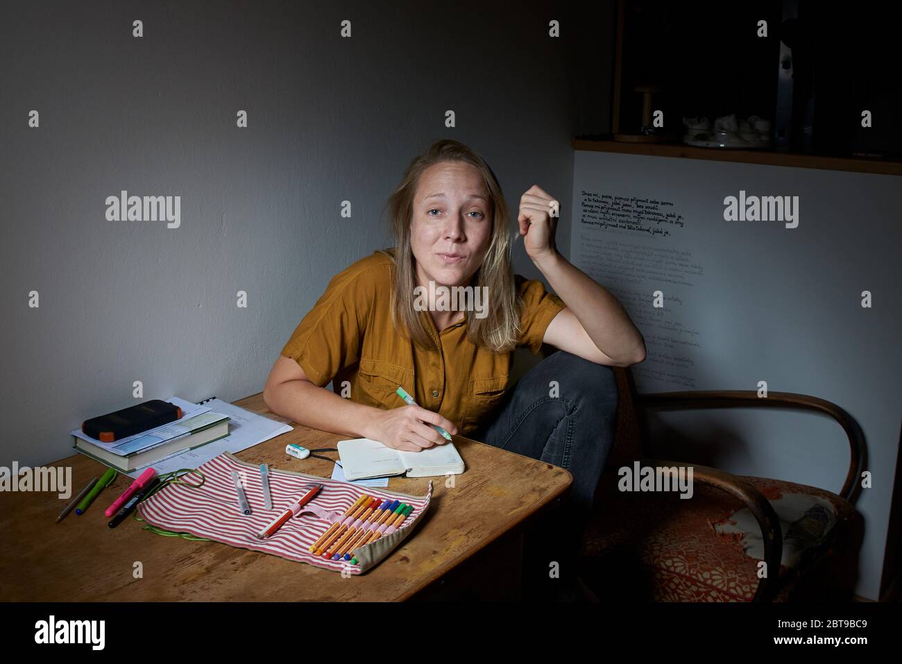 Environmental portrait of a female artist in her basement apartment in ...
