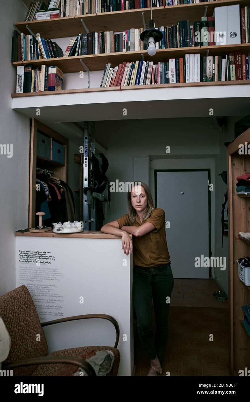 Environmental portrait of a female artist in her basement apartment in ...