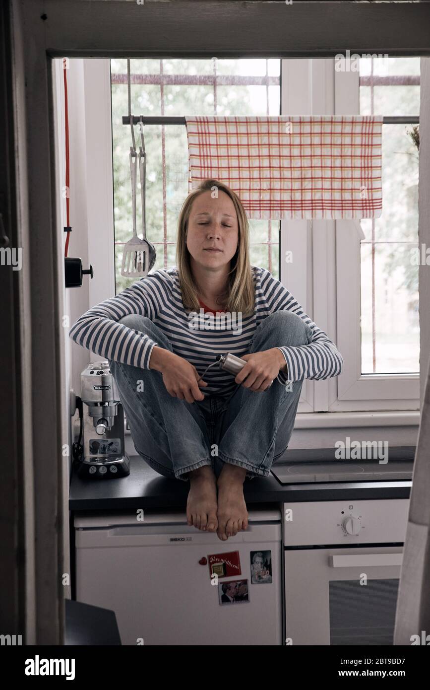 Environmental portrait of a female artist in her basement apartment in ...
