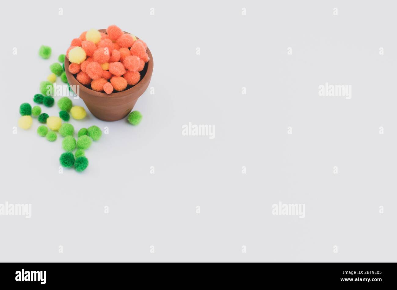 colored balls in a pot - floral theme concept Stock Photo - Alamy