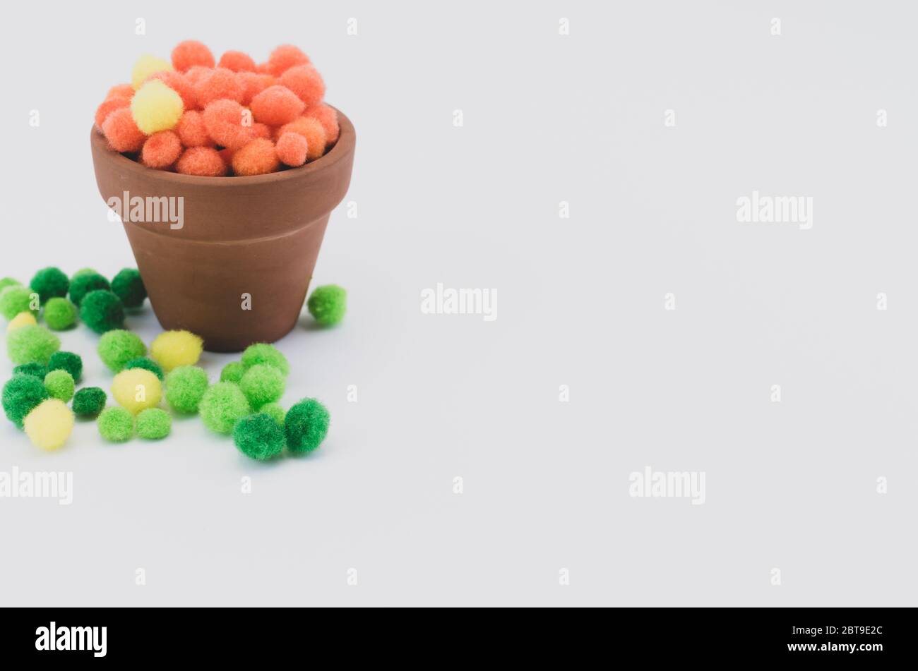 colored balls in a pot - floral theme concept Stock Photo - Alamy
