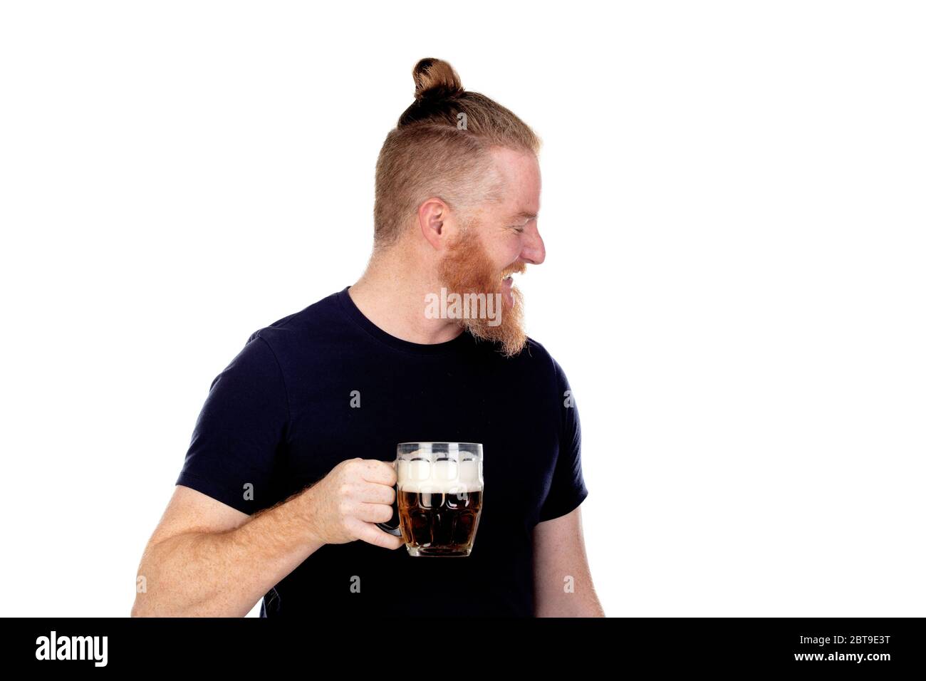 Red haired man with long beard drinking a beer isolated on a white ...