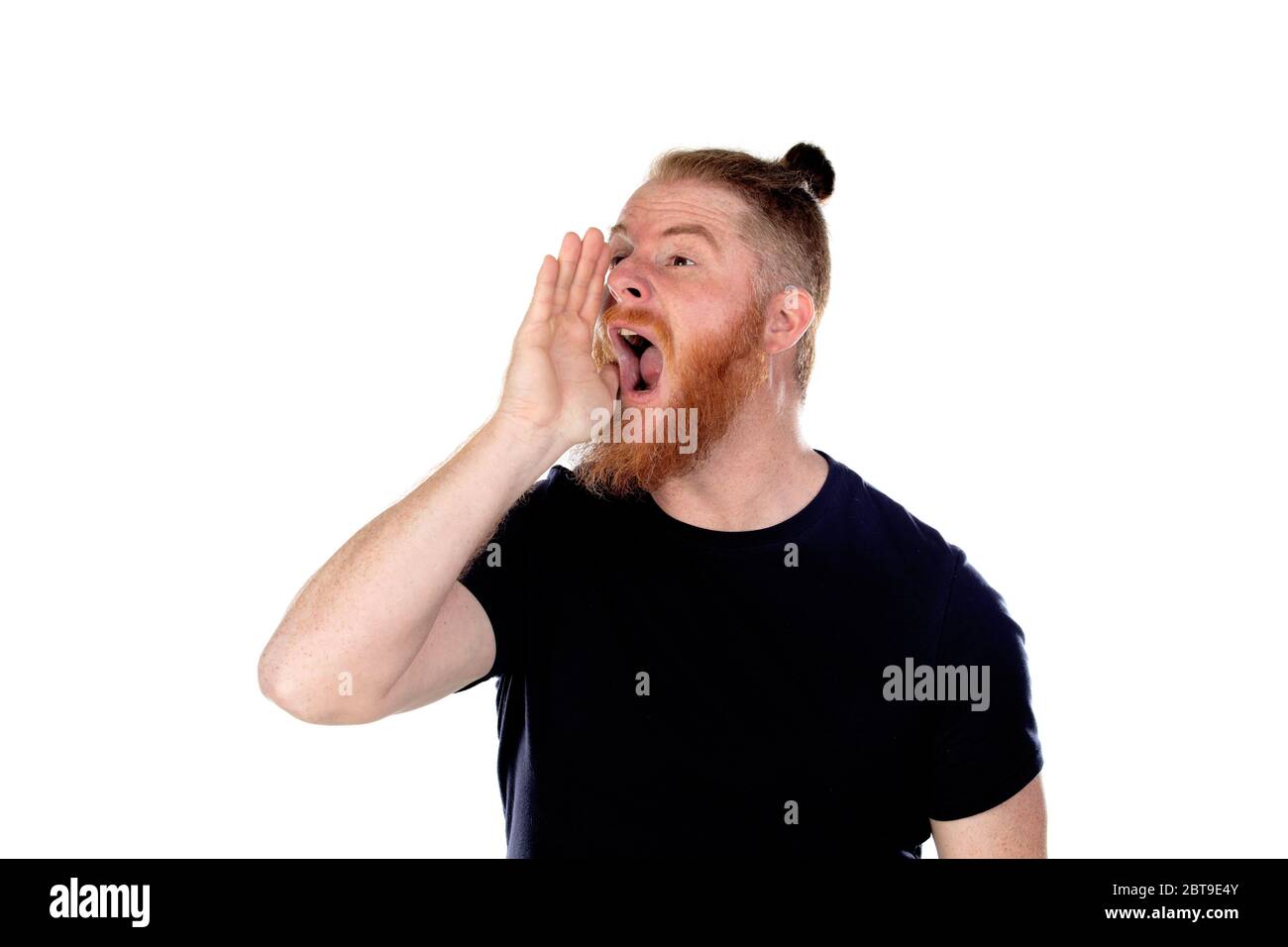 Red haired man with long beard shouting isolated on a white background ...