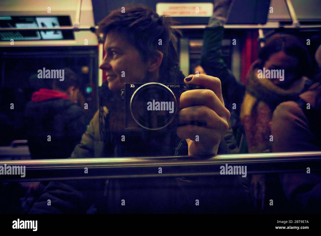 Self portrait of a female street photographer from a city tramway as a ...