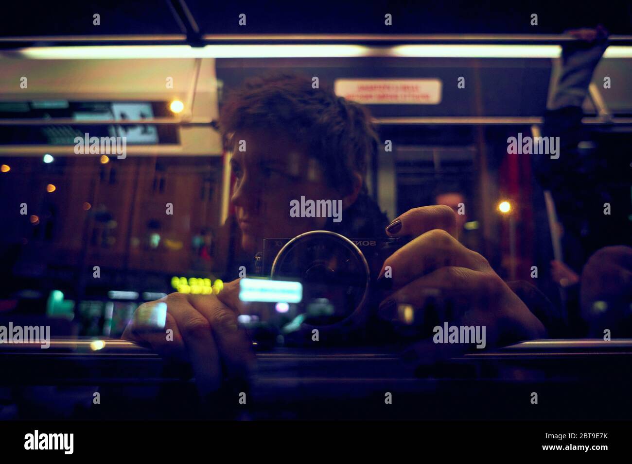 Self portrait of a female street photographer from a city tramway as a ...