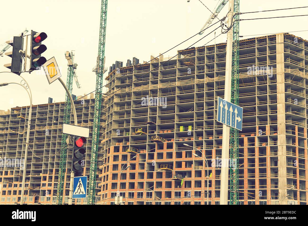 The stopped construction of a high-rise building. Unfinished floors of ...