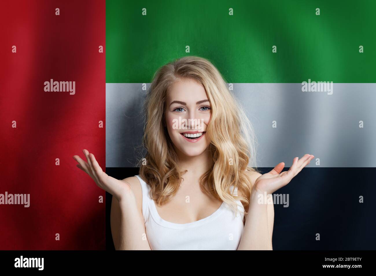 Arabic concept with happy Surprised cute girl with UAE flag background ...
