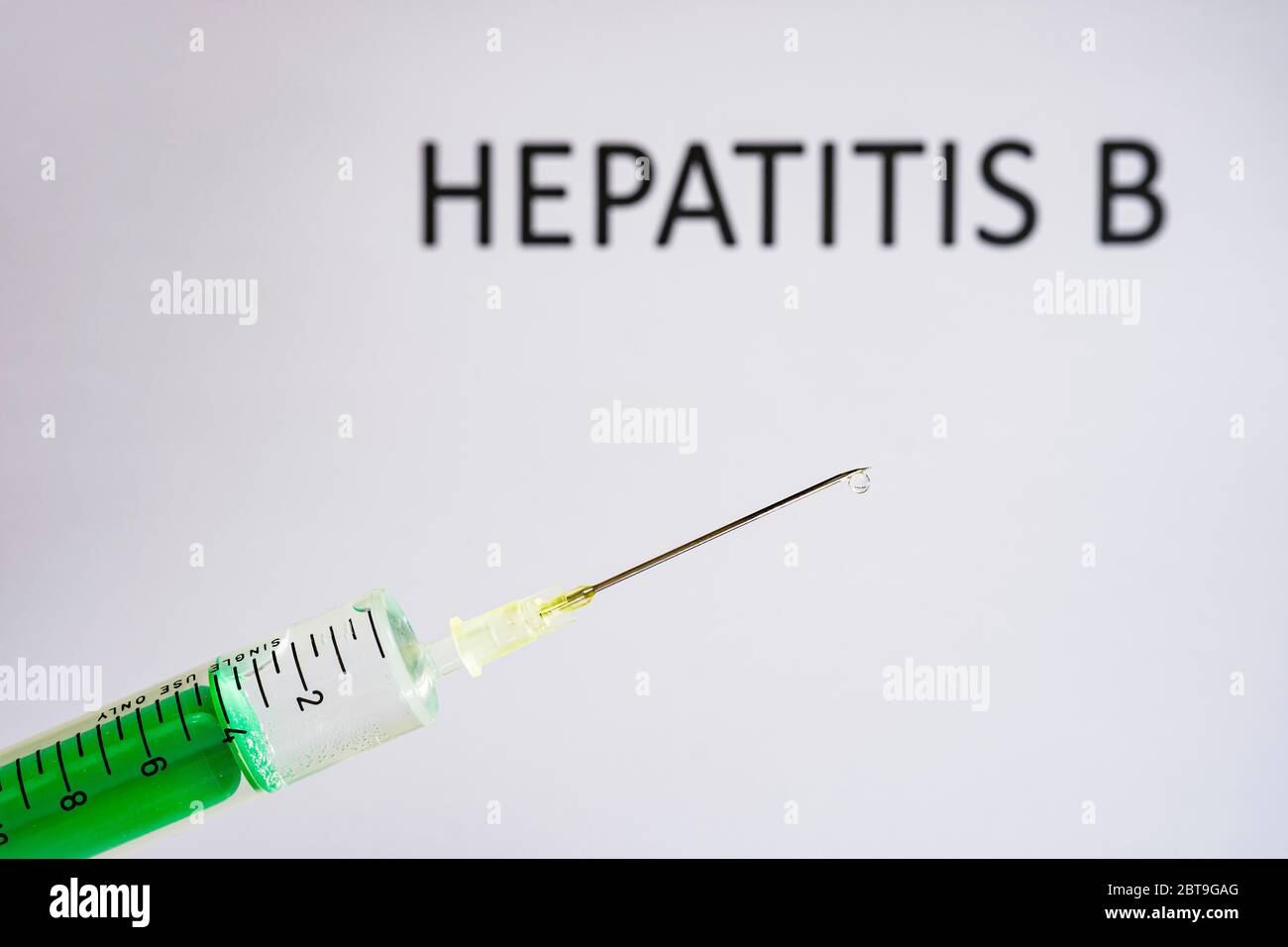 This photo illustration shows a disposable syringe with hypodermic ...