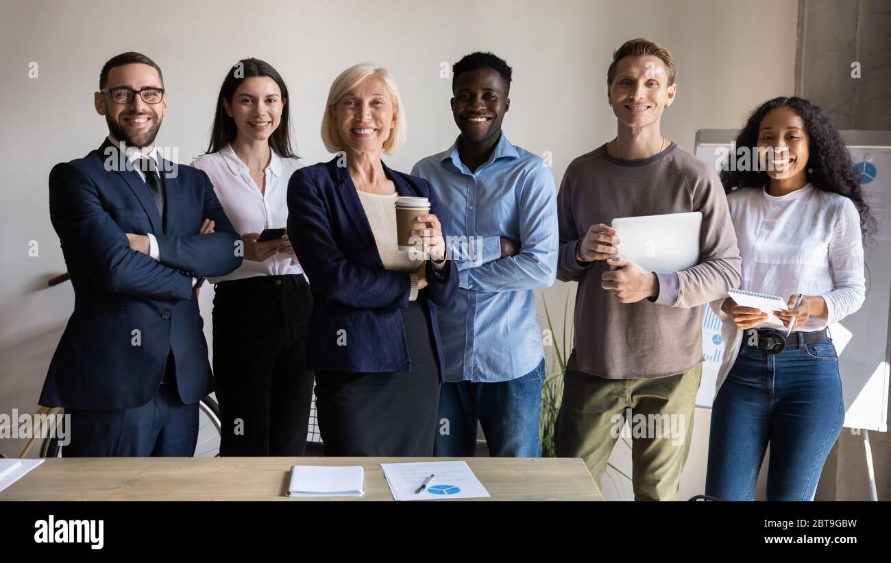Smiling diverse employees posing for corporate portrait in office ... Smiling diverse employees posing for corporate portrait in office ...