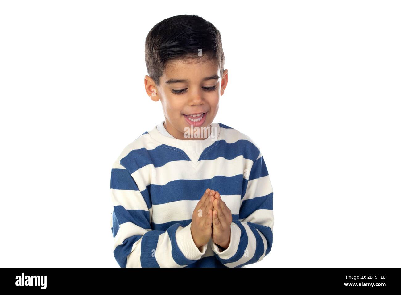 Adorable latin child praying isolated on a white background Stock Photo ...