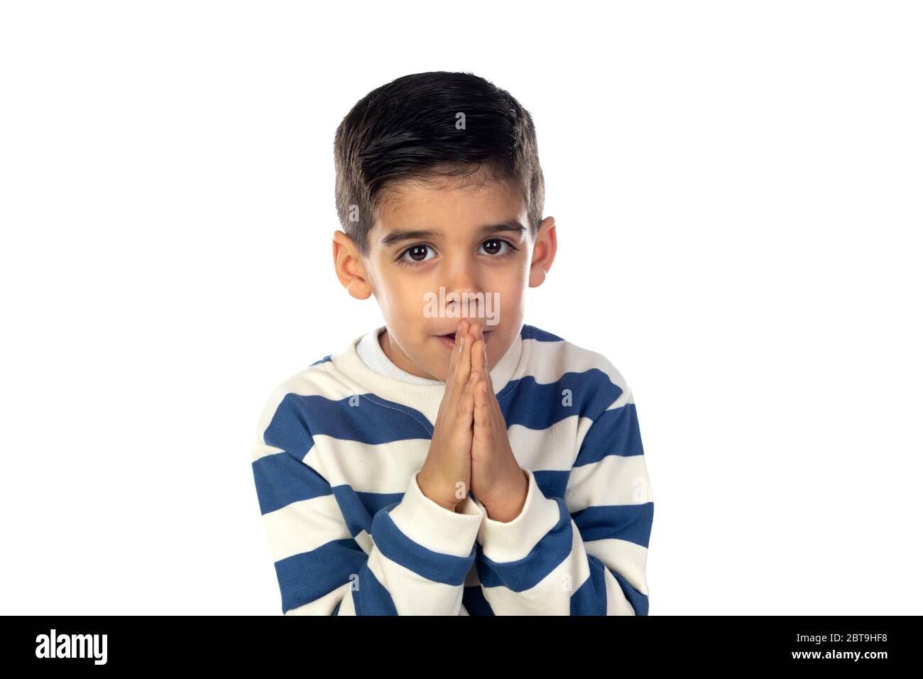 Adorable latin child praying isolated on a white background Stock Photo ...
