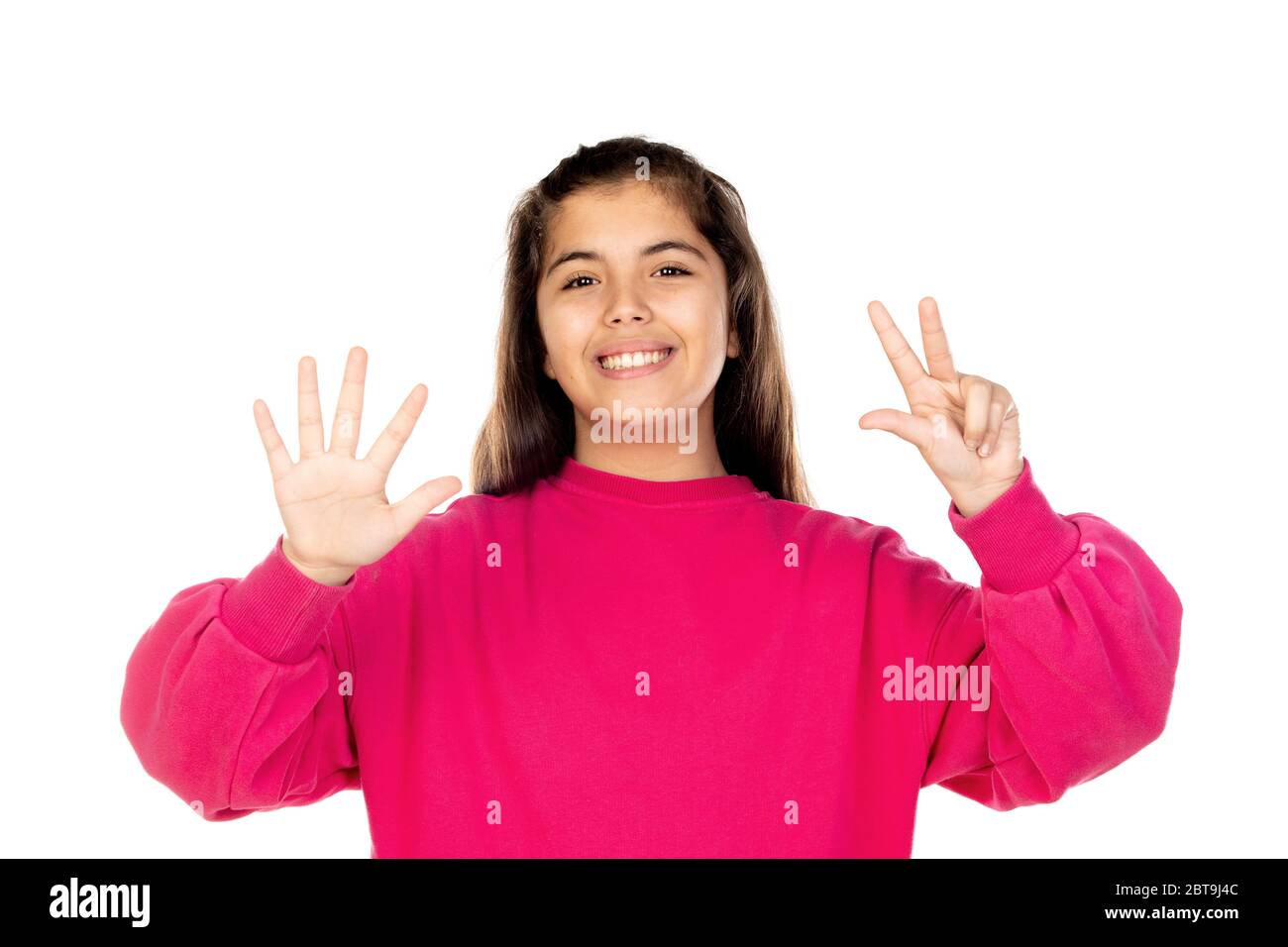 Adorable preteen girl with pink jersey isolated on a white background ...