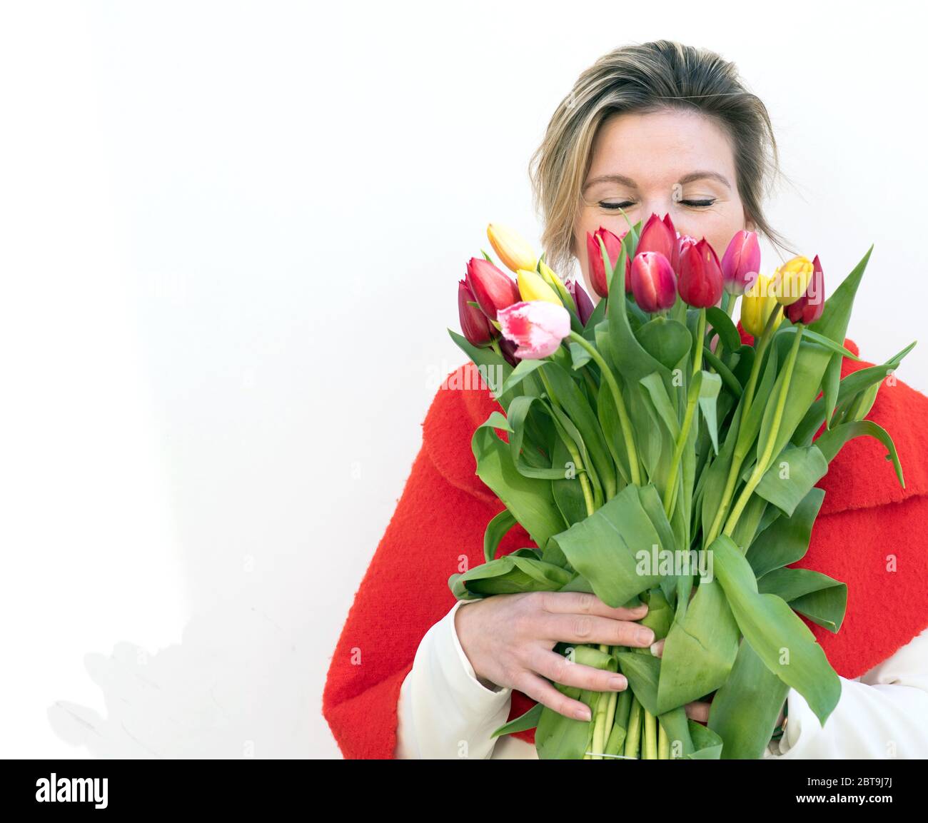 dutch flowers tulips beautiful woman behind flowers Stock Photo - Alamy