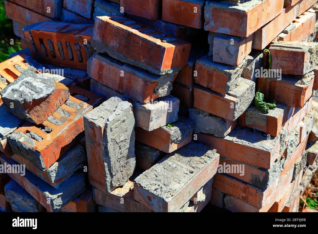 pile of used red bricks Stock Photo - Alamy