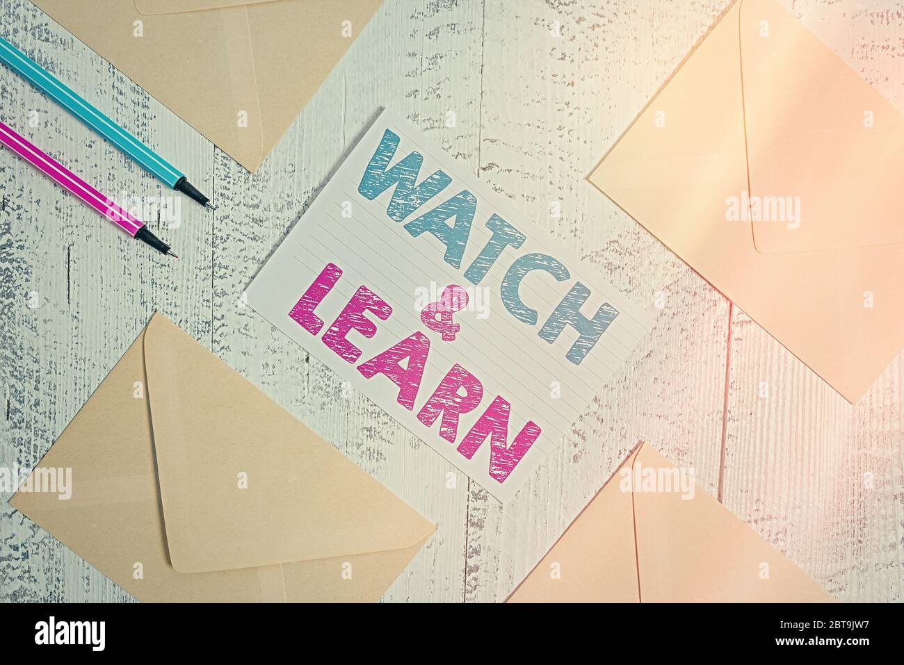 Writing note showing Watch And Learn. Business concept for ...