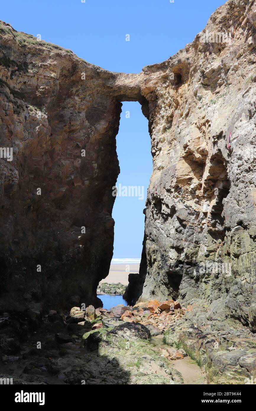 Close up of rocky arch with blue sky Stock Photo - Alamy