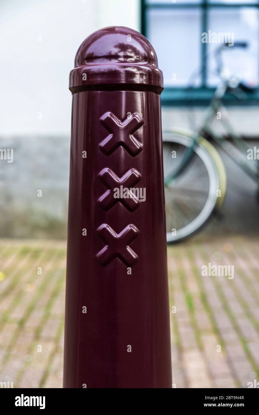 Bollard with the shield of the three crosses of Amsterdam in the old ...