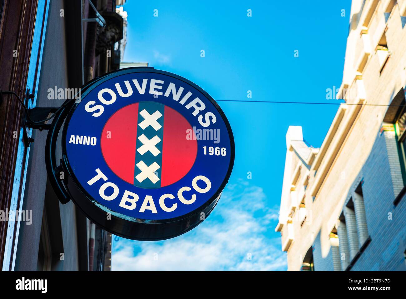 Round sign of a souvenir and tobacco shop with the shield of the three ...