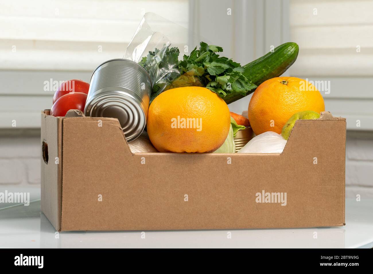 box with donations on the table. grocery set for poor people Stock ...