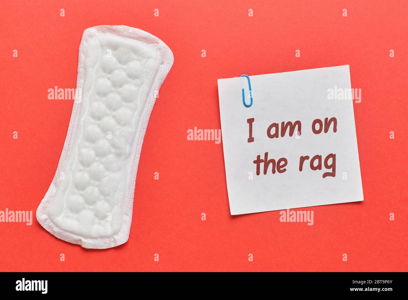 Women pad on a red background with a sticker and the inscription I am ...