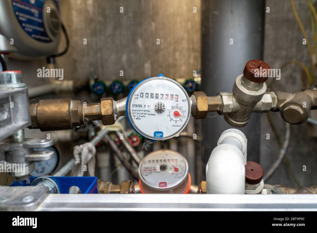 turn off hot water. plumbing cabinet. water meters, collector, water ...