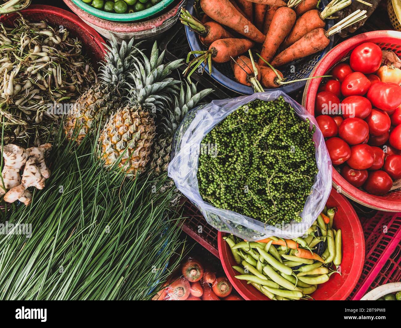 Top view on a large assortment of row loose vegetables and fruits for ...
