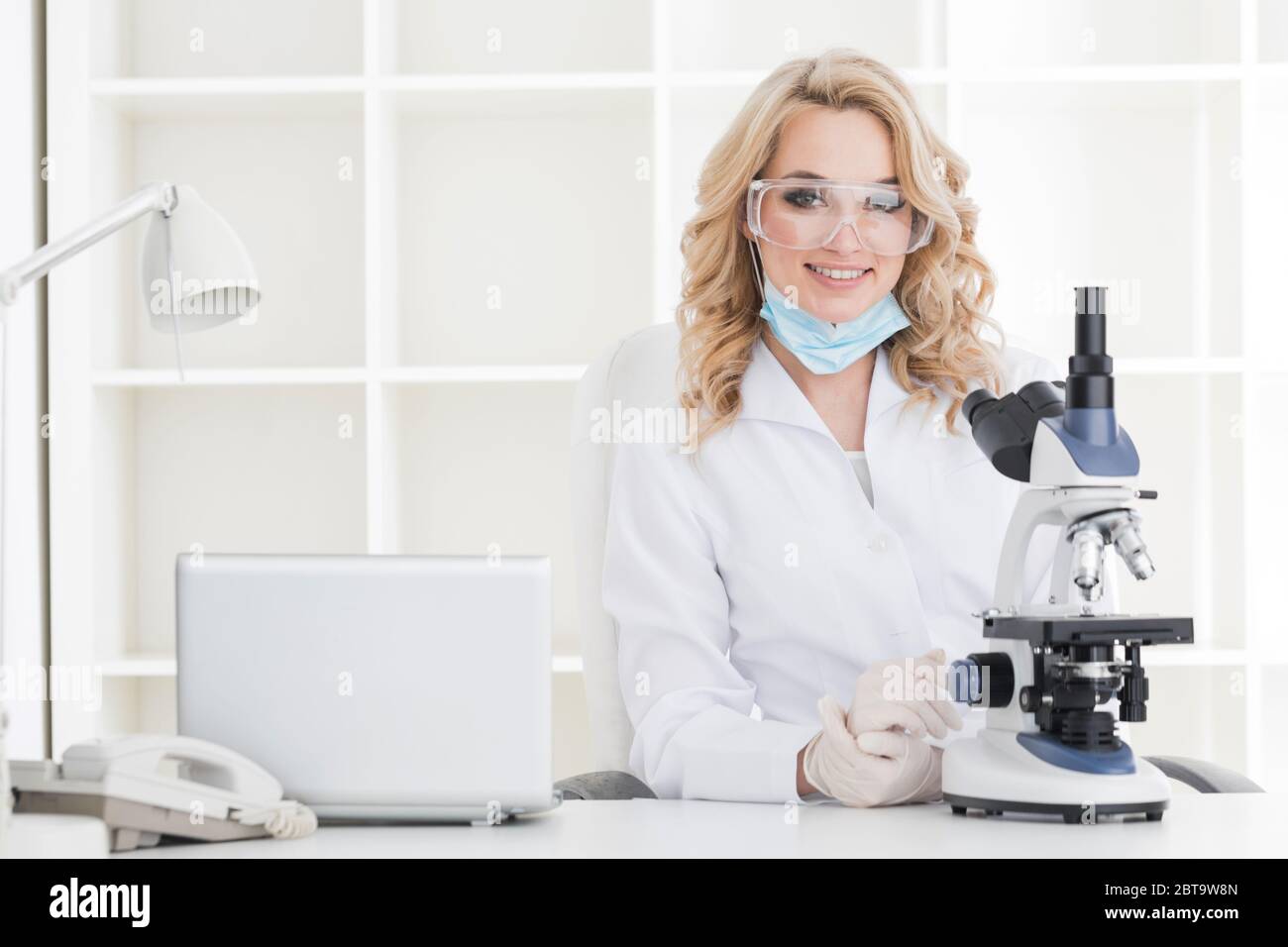 Portrait of a female researcher or medical doctor doing research using ...