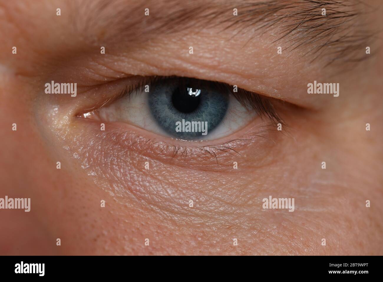 Close-up unkind angry look man, eye young man Stock Photo - Alamy